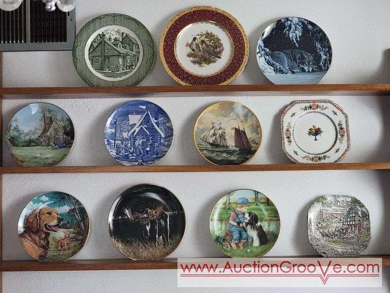 24 Collectors Plates and Display Shelf. See photos for entire contents ...