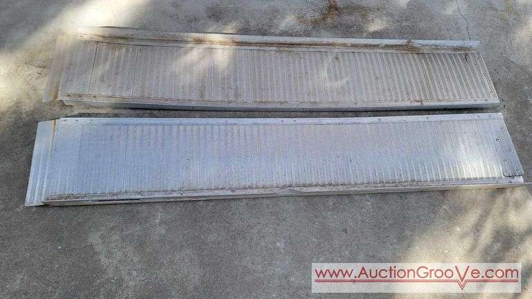 A pair of 6 foot long by 13 inch wide aluminum ramps.See photos for ...