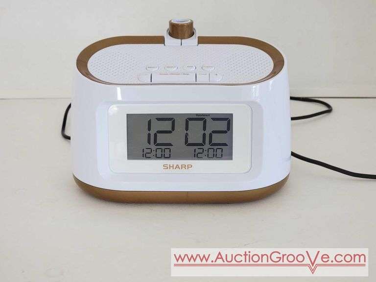 SHARP Alarm Clock. Projects Time on the ceiling or wall it is ...