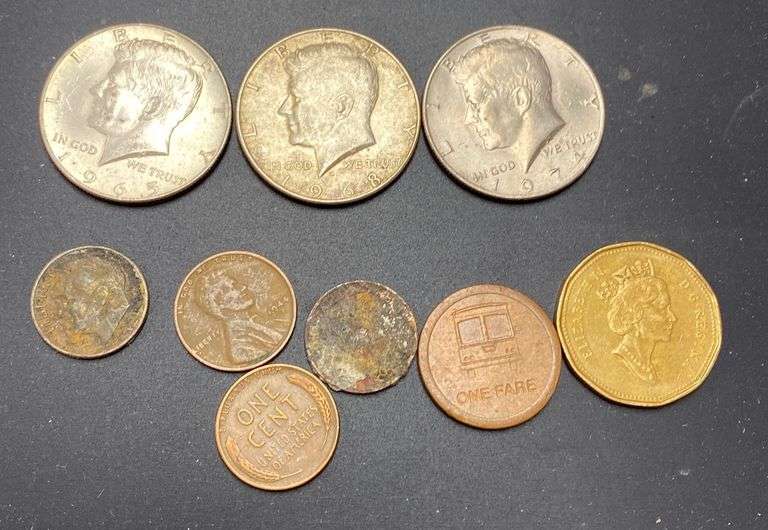 Three Kennedy half dollars, Roosevelt dime three pennies, bus token ...