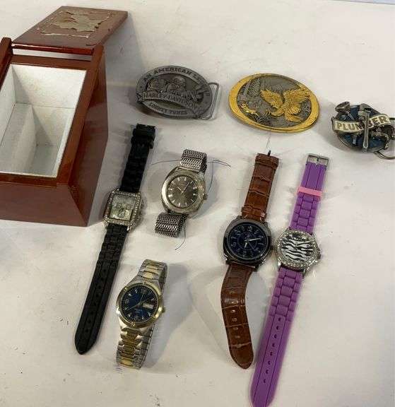 Container with five wrist watches and three belt buckles - Hash Auctions