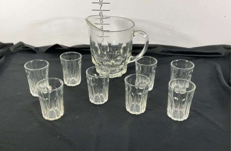 Glass water pitcher and 8 juice/ shot glasses - Hash Auctions