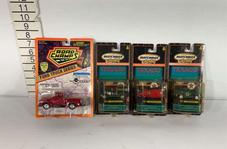Four cars in original packaging, includes Road Champs ford F-100, and ...