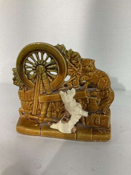 McCoy planter, dog and spinning wheel, 7in tall - Hash Auctions
