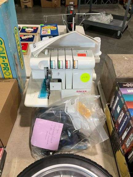Singer, serger sewing machine with operations guide and accessories ...