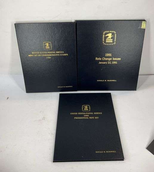 Three commemorative stamp books, 1986 postal service mint set, 1986 ...