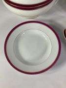 Twenty three piece dining set. Cranberry colored rim with gold trim ...