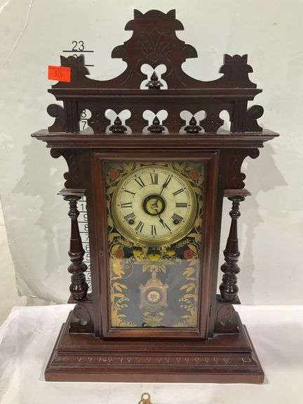 Ornate clock with key. - Hash Auctions