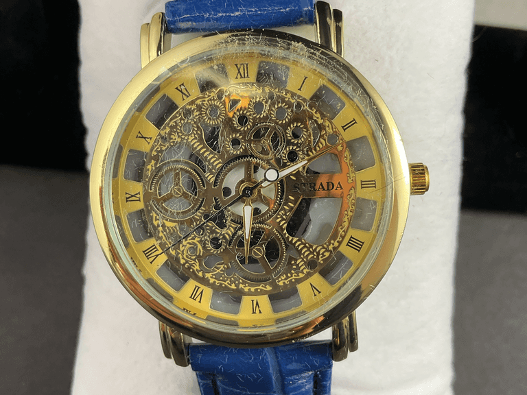 Strada Japanese movement goldtone skeleton dial watch with 5.5-8in blue ...