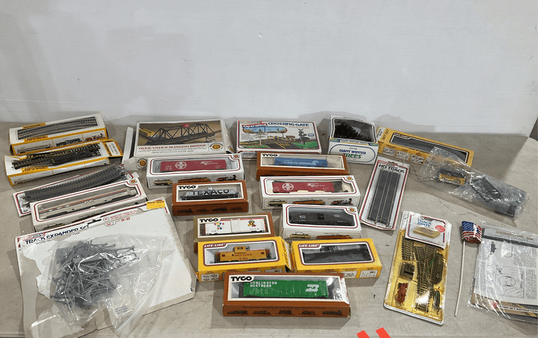 Group of HO scale train cars, in boxes, some track, model train ...