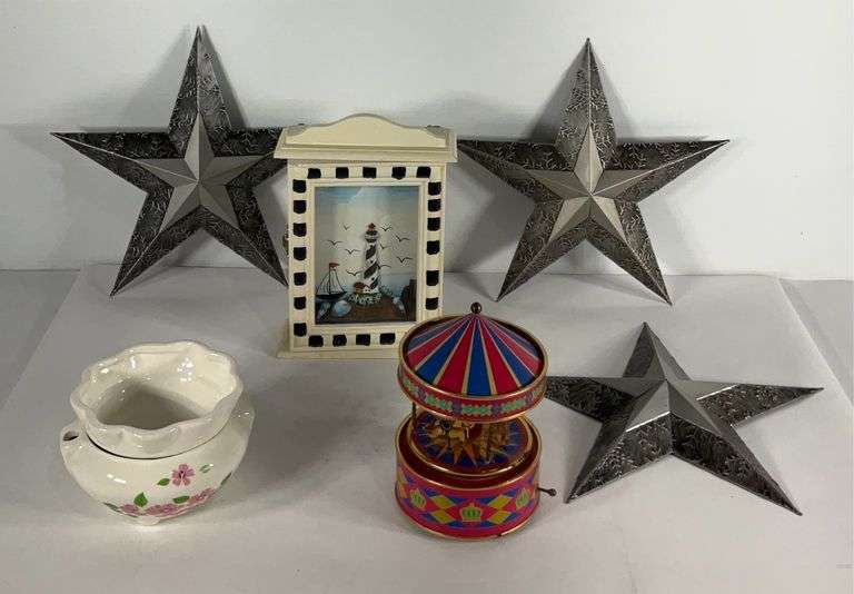 Three decorative stars, musical carousel, lighthouse jewelry box and ...