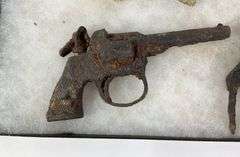 Rusty gun relics in case. - Hash Auctions