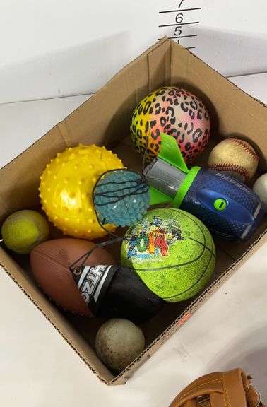 Box of balls and mitts. - Hash Auctions