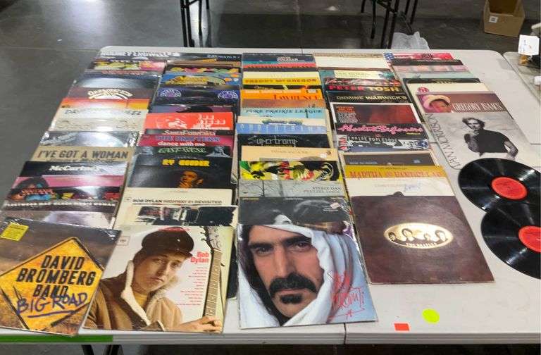 75+ records. Includes Santana, The Beatles, Van Morrison, John Cougar ...
