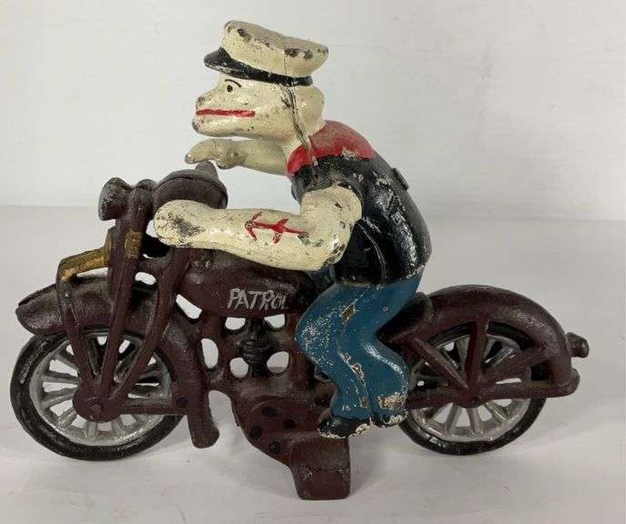 Cast iron Popeye on motorcycle - Hash Auctions