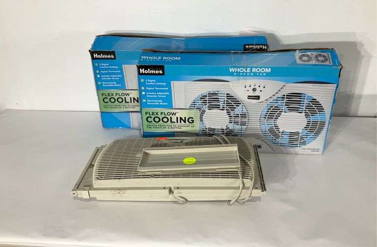 Three Holmes window fans, two are in box, the other does power on ...