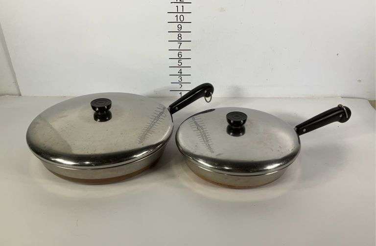 Two Revere Ware pans with lids. - Hash Auctions