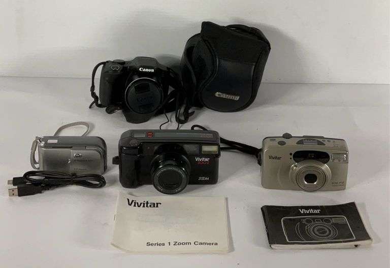 Two Vivitar cameras, Hp Photosmart, and a Canon camera. - Hash Auctions