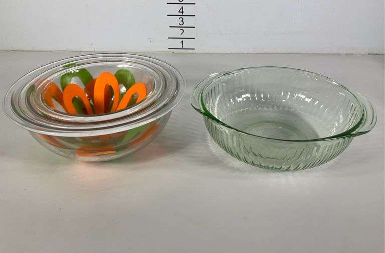 Three Pyrex nesting bowls with felt flower dividers. One green glass ...