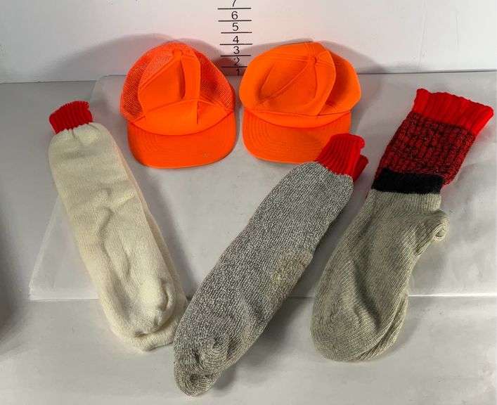 Two orange hats and three pair of warm heavy socks. - Hash Auctions