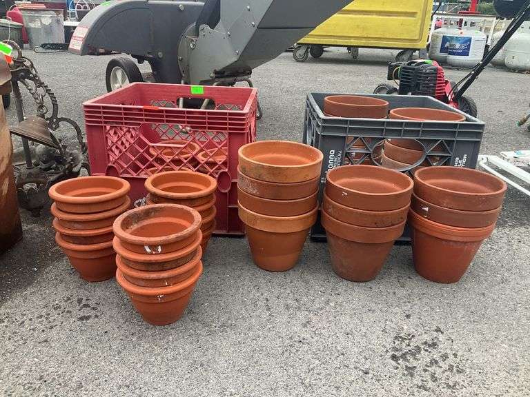 Two poly crates and various clay planters - Hash Auctions