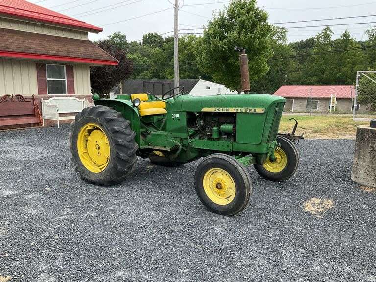 John Deere 2010 Tractor, serial #RU11060. 4-cylinder Gas Engine, front ...