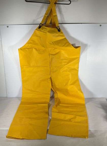Yellow water proof bib overalls. Small hole see photos. - Hash Auctions
