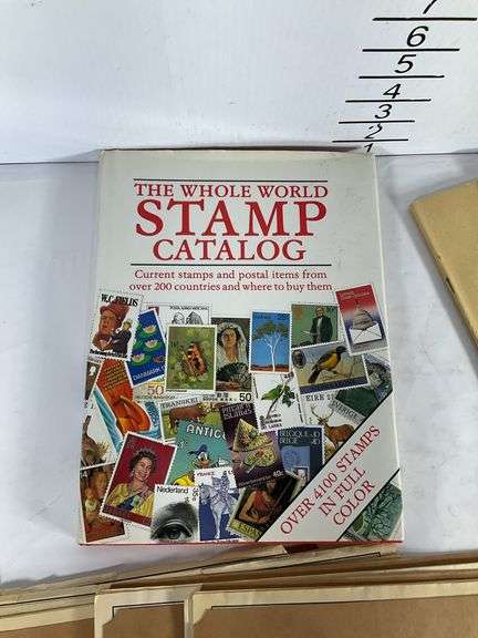 Three stamp books, four folders, and a baggie of canceled stamps. Also ...