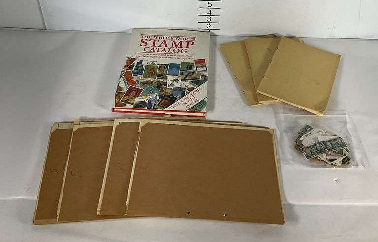 Three stamp books, four folders, and a baggie of canceled stamps. Also ...