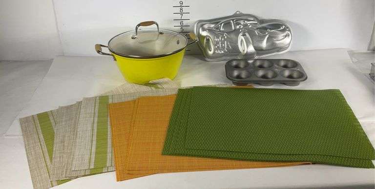 14 placemats, Lightning McQueen mold, cupcake pan and pot with lid ...