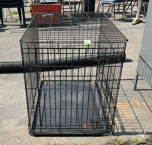 Wire pet cage with poly liner, 36”L x24”W x 27”H, some bending of wire ...