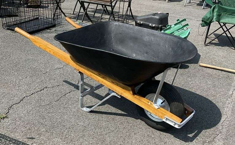 Wheelbarrow, metal hopper, two wooden handles, tire has air - Hash Auctions