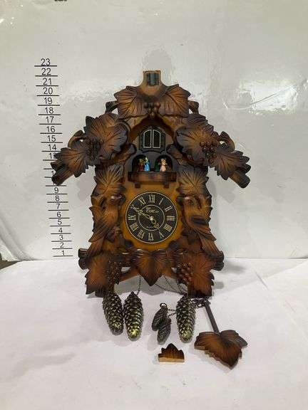 The Time Co. large cuckoo clock. It does have a piece broken off but ...