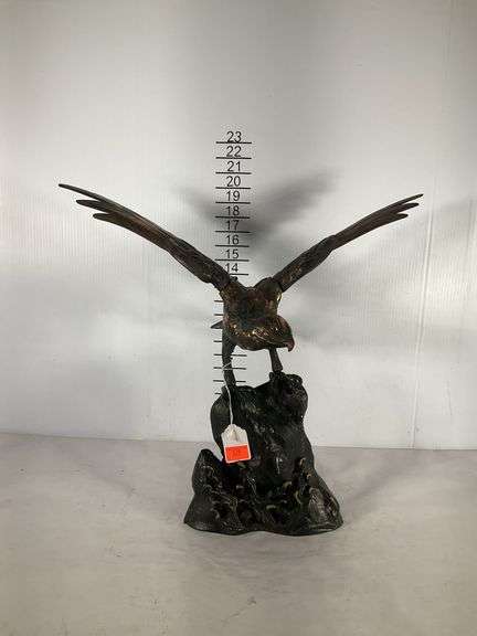 Cast metal and brass Hawk statue. Wing span 20.5in - Hash Auctions