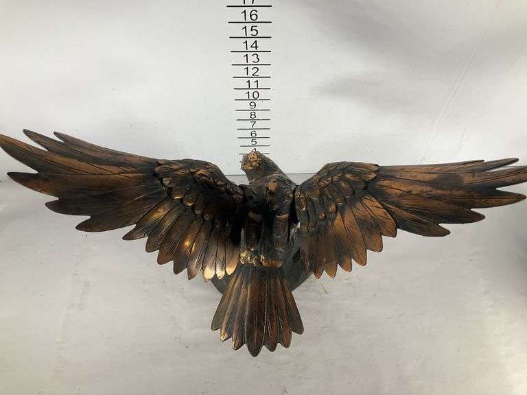 Cast metal and brass Hawk statue. Wing span 20.5in - Hash Auctions