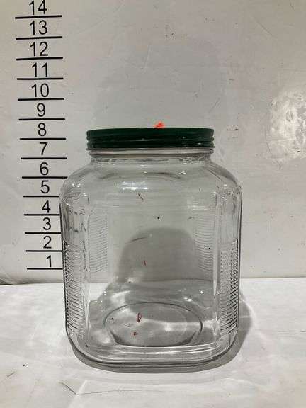 Clear Glass Jar with Green Screw-Top Lid - Hash Auctions