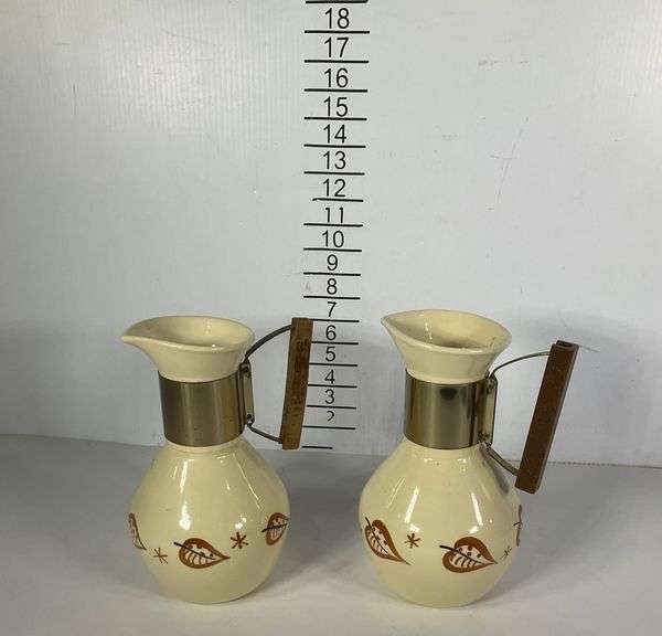 Pair of Ceramic Pitchers with Metal Handles and Decorative Motifs ...