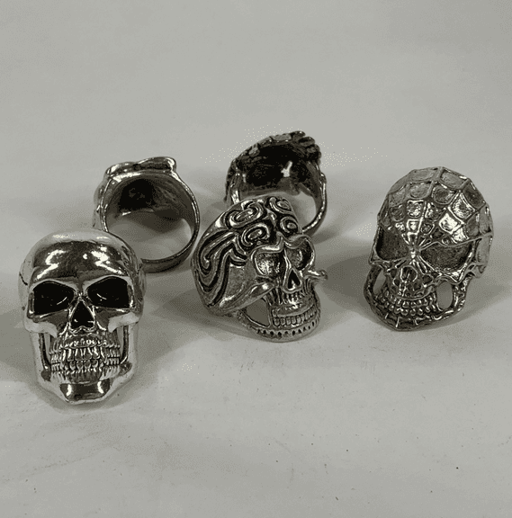 Five Silver-Tone Skull Rings with Detailed Designs - Hash Auctions
