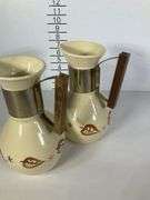 Pair of Ceramic Pitchers with Metal Handles and Decorative Motifs ...