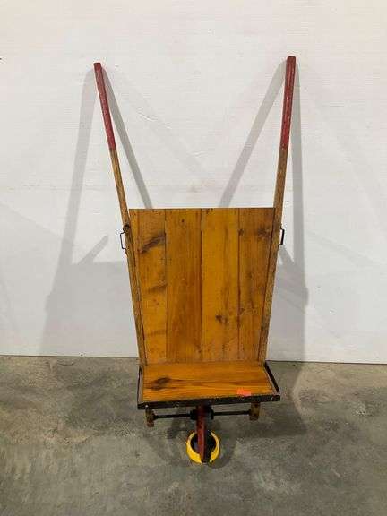 Decorative One-Wheeled Cart with Red-Handled Frame and Wooden Panel ...