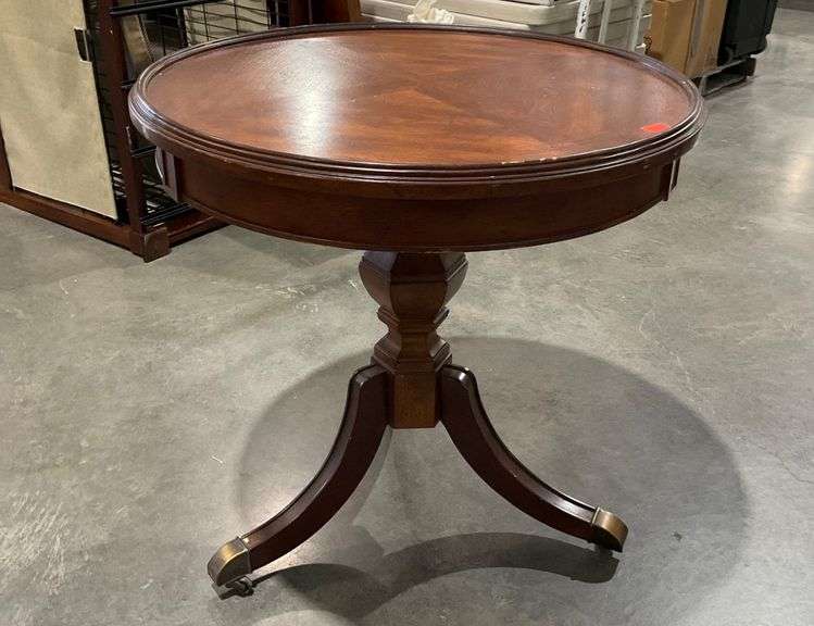 Round Accent Table with Tri-Foot Base and Brass-Capped Feet on Wheels ...
