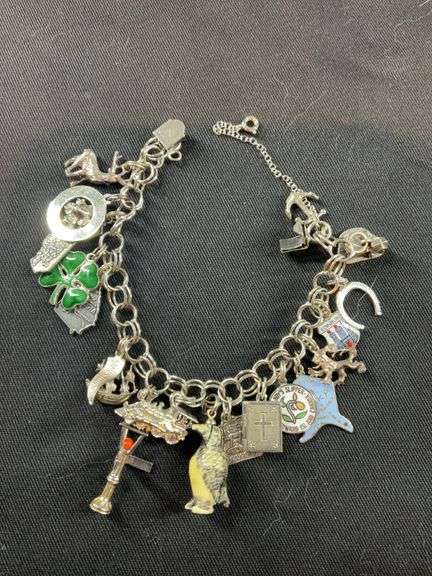 Sterling silver charm bracelet 7in , 50.4g - Hash Auctions