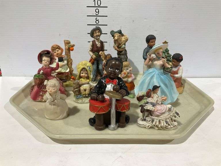Collection of Hand-Painted Ceramic Figurines Depicting Various ...