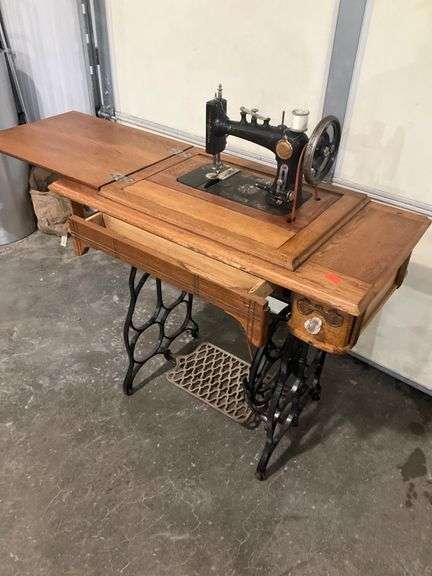 Early 20th-Century Treadle Sewing Machine in Wood Cabinet - Hash Auctions
