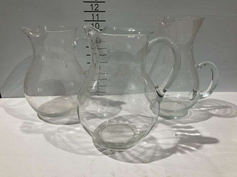 Set of Three Clear Glass Pitchers with Etched Details - Hash Auctions