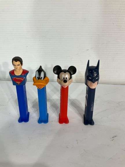 Set of Four PEZ Dispensers Featuring Superman, Daffy Duck, Mickey Mouse ...