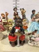 Collection of Hand-Painted Ceramic Figurines Depicting Various ...