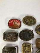 Collection of Ten Brass Belt Buckles with Varied Themes - Hash Auctions