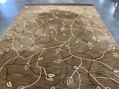 Bashian Camel-Colored Area Rug with Vine and Leaf Pattern - Hash Auctions