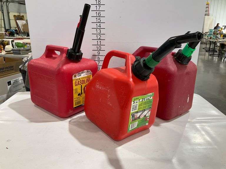 Three Red Plastic Gasoline Containers with Attached Spouts - Hash Auctions